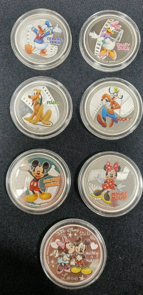 (7) Disney Character Silver Plated Collectable Coins