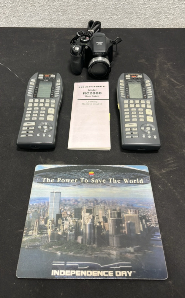 (1) Fujifilm Camera (2) Marantz RC2000 Learning Reomote Control (1) Apple Independence Day Mousepad