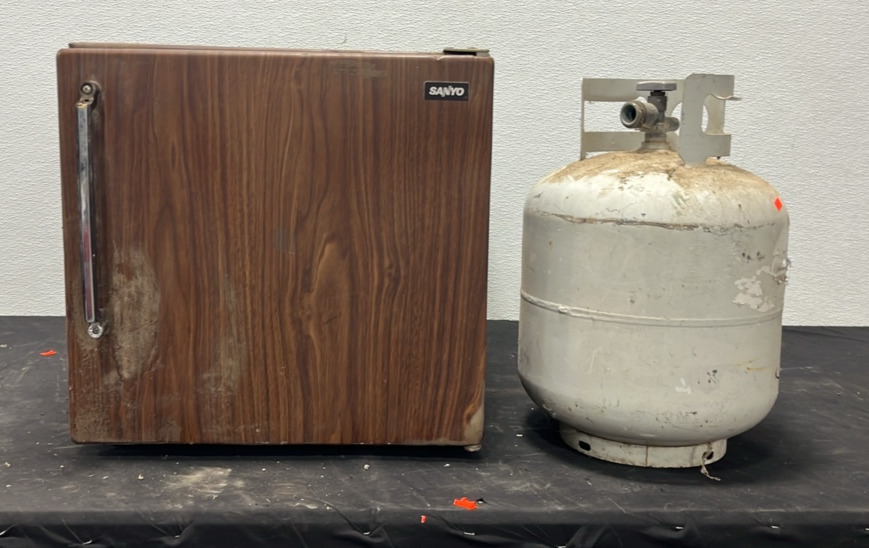 (1) Sanyo Mini Fridge (1) Propane Tank